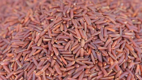 Red rice closeup,Pile of unpolished rice... | Stock Video | Pond5