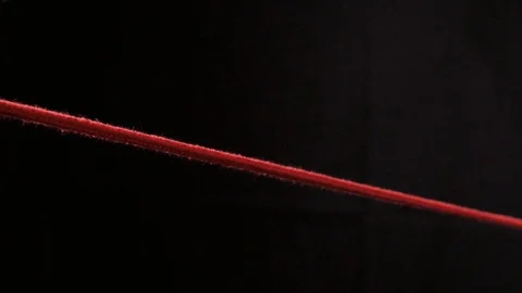 Red rope on black background | Stock Video | Pond5