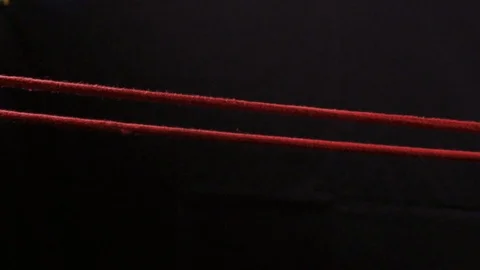 Red rope on black background | Stock Video | Pond5