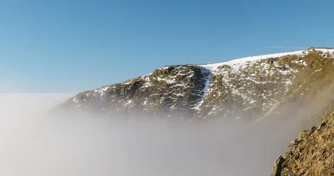 Red Screes above valley mist from a temp... | Stock Video | Pond5