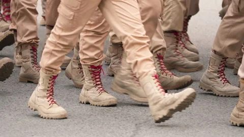 Red shoes stepping. Army soldier wear bo... | Stock Video | Pond5