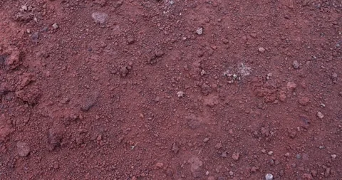 Red soil texture background on volcano | Stock Video | Pond5
