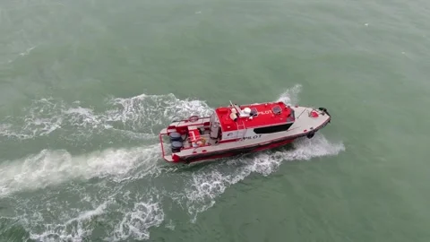 red speed boat on patrol in indonesian s... | Stock Video | Pond5