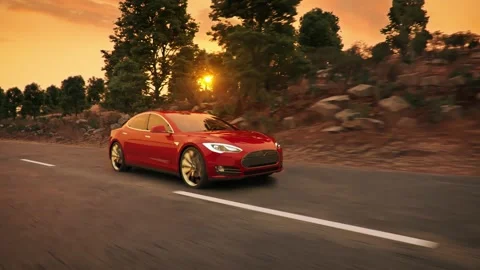 Red Tesla Model S electric vehicle drivi... | Stock Video | Pond5