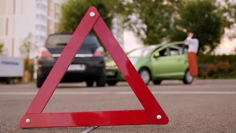A red triangle on the road, an accident ... | Stock Video | Pond5