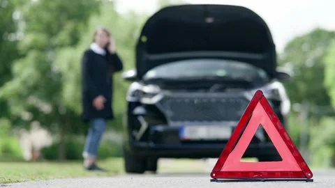 A red triangular emergency stop sign on ... | Stock Video | Pond5