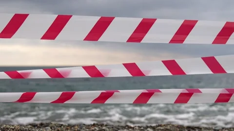 Red white warning tape barrier ribbon sw... | Stock Video | Pond5