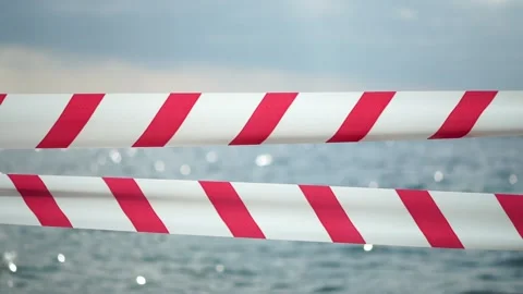 Red white warning tape barrier ribbon sw... | Stock Video | Pond5