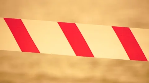 Red white warning tape barrier ribbon sw... | Stock Video | Pond5