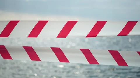 Red white warning tape barrier ribbon sw... | Stock Video | Pond5
