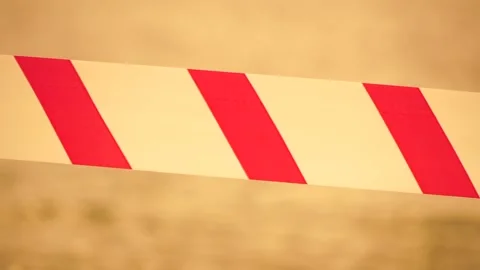 Red white warning tape barrier ribbon sw... | Stock Video | Pond5