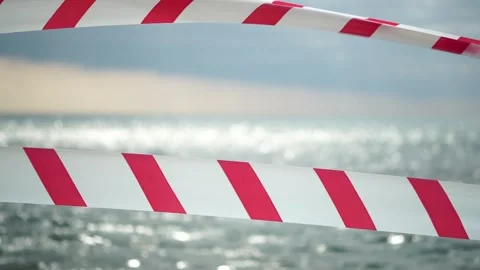 Red white warning tape barrier ribbon sw... | Stock Video | Pond5
