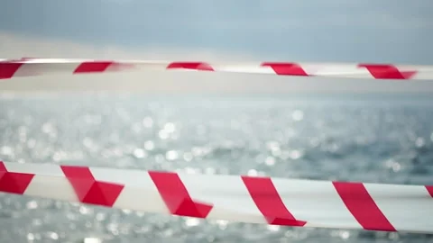 Red white warning tape barrier ribbon sw... | Stock Video | Pond5