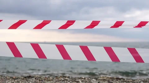 Red white warning tape barrier ribbon sw... | Stock Video | Pond5