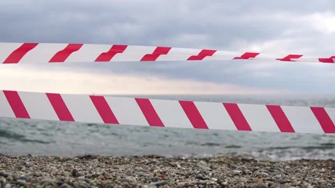 Red white warning tape barrier ribbon sw... | Stock Video | Pond5