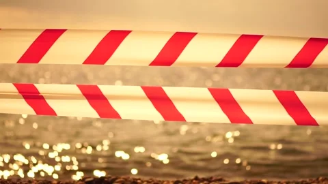 Red white warning tape barrier ribbon sw... | Stock Video | Pond5
