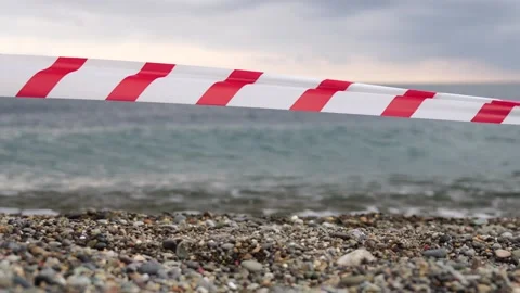 Red white warning tape barrier ribbon sw... | Stock Video | Pond5