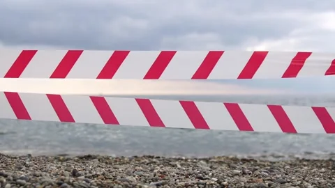 Red white warning tape barrier ribbon sw... | Stock Video | Pond5