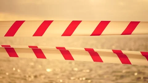 Red white warning tape barrier ribbon sw... | Stock Video | Pond5