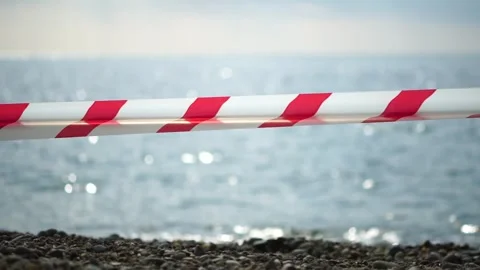 Red white warning tape barrier ribbon sw... | Stock Video | Pond5