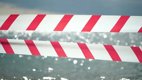 Red white warning tape barrier ribbon sw... | Stock Video | Pond5