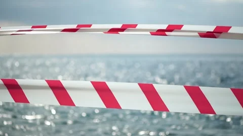 Red white warning tape barrier ribbon sw... | Stock Video | Pond5