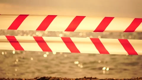 Red white warning tape barrier ribbon sw... | Stock Video | Pond5