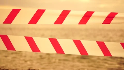 Red white warning tape barrier ribbon sw... | Stock Video | Pond5