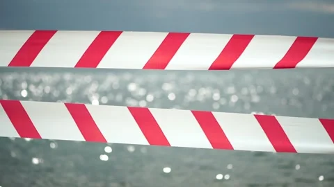 Red white warning tape barrier ribbon sw... | Stock Video | Pond5