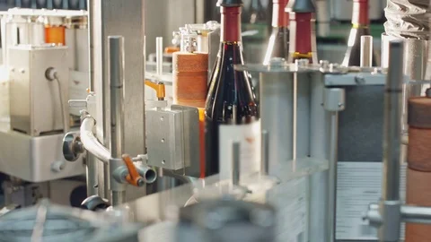 Red Wine bottles labeling process in a w... | Stock Video | Pond5
