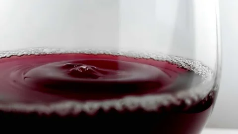 red wine drop falling down into drink gl... | Stock Video | Pond5