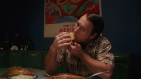 Reenactment: Zoom-in shot of a man eatin... | Stock Video | Pond5