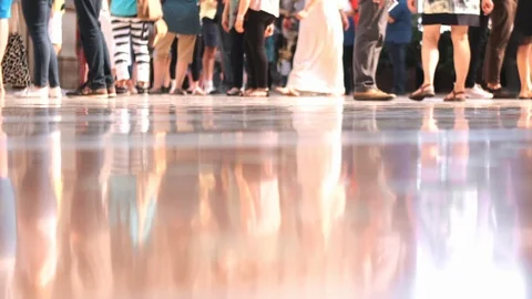 Reflection of crowd on marble floor in s... | Stock Video | Pond5