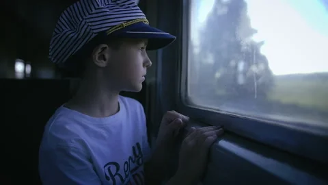 Reflective Journey: Sad Boy Observing Th... | Stock Video | Pond5