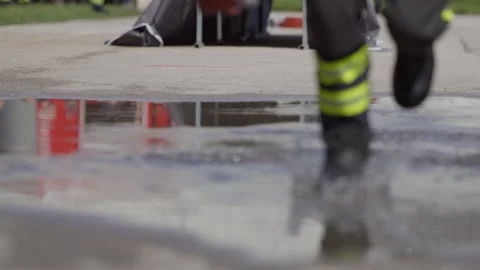 A reflective scene captures a firefighte... | Stock Video | Pond5