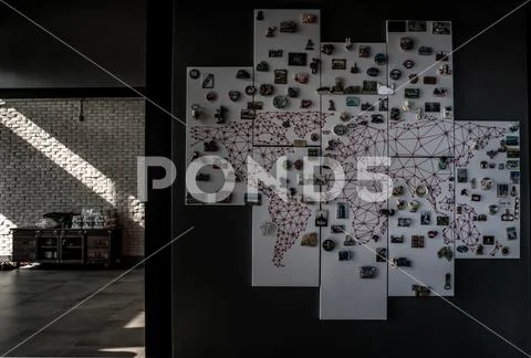 Refrigerator magnets from different cities of the world on whiteboard ...