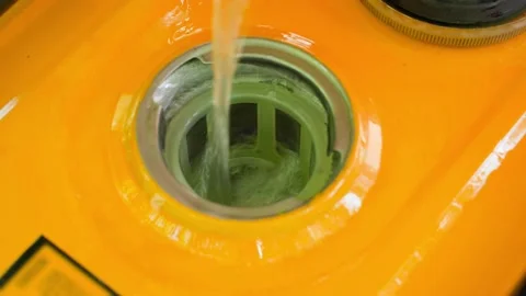 Refueling a gasoline generator. A jet of... | Stock Video | Pond5