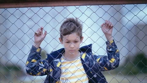 Regretful Gaze: Sad Boy Stands Behind Fe... | Stock Video | Pond5