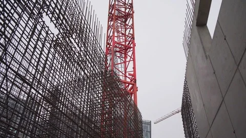 Reinforced concrete rods and red crane i... | Stock Video | Pond5