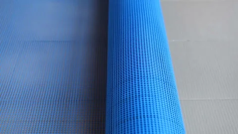 Reinforcing blue fiberglass mesh for fac... | Stock Video | Pond5