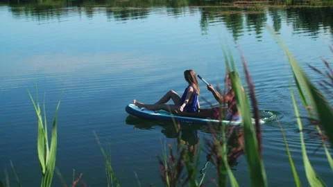 Relaxed couple man and woman floating on... | Stock Video | Pond5