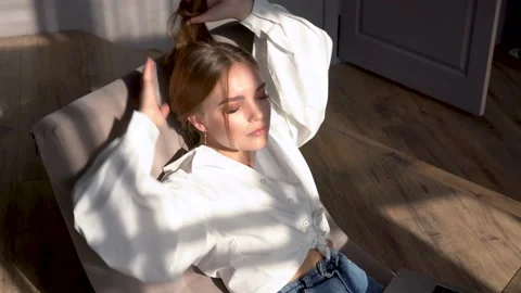 Relaxed model posing for a photo sitting... | Stock Video | Pond5