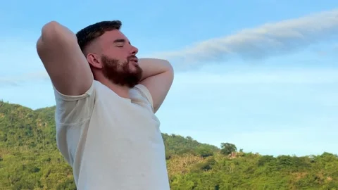 relaxed young man breathing deeply, guy ... | Stock Video | Pond5