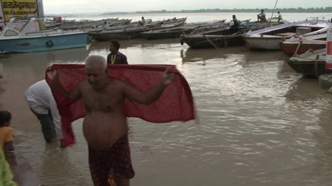 Religious Hindus bath in the Ganges Rive... | Stock Video | Pond5