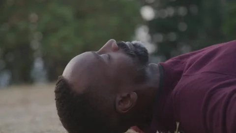 Religious Man Laying On His Back Praying | Stock Video | Pond5