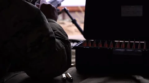 reloading the rifle, adjusting the sight... | Stock Video | Pond5