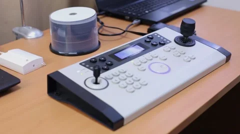 Remote control panel and notebooks at ta... | Stock Video | Pond5