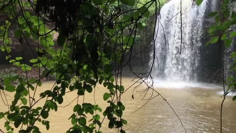 Remote waterfall in distance behind big ... | Stock Video | Pond5