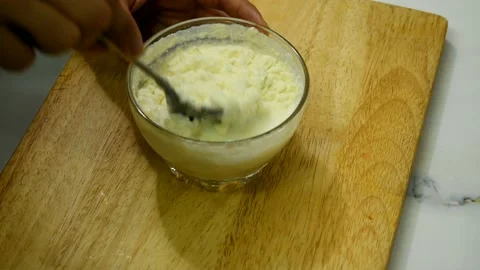 removing lumps of milk powder in a bowl ... | Stock Video | Pond5