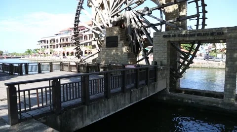 Renovated watermill stands in a park on ... | Stock Video | Pond5